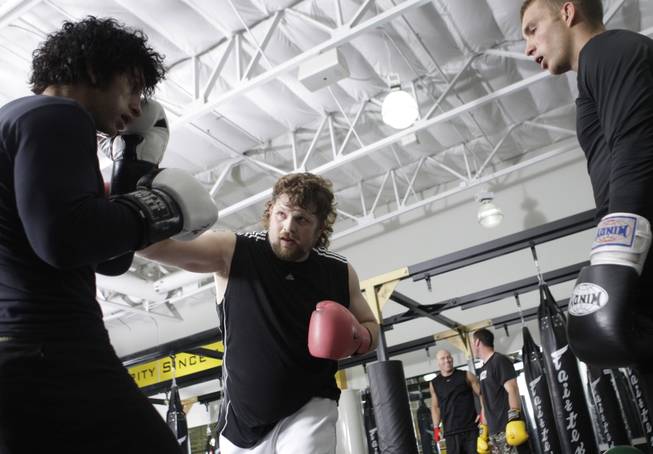 MMA Fighter Roy Nelson - MMA fighter Roy Nelson, center, gives ...
