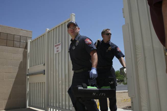 Mock drowning exercise - Paramedics D. Raney and J. Larson, right, rush ...