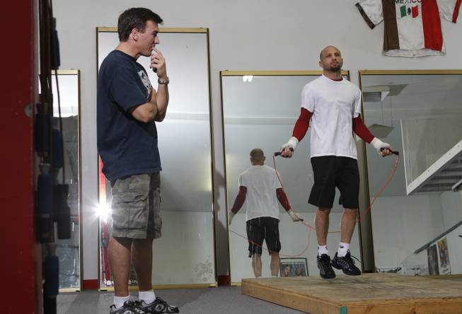 Clarence "Bones" Adams - Trainer Steve Rowlands, left, watches as ...