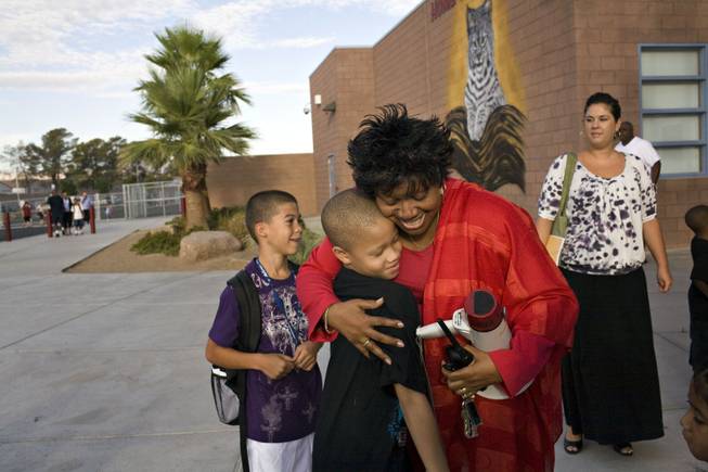 West Las Vegas -- First Day of School - Principal Beverly Mathis greets ...