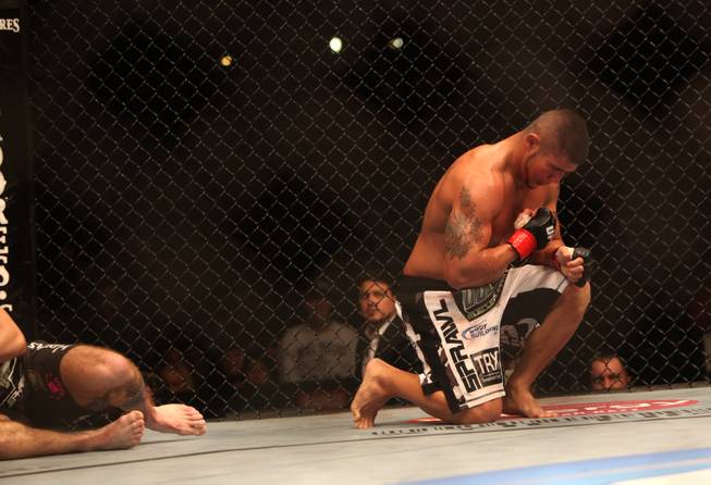 UFC 104 undercard - Joe Stevenson takes a knee after beating Spencer ...
