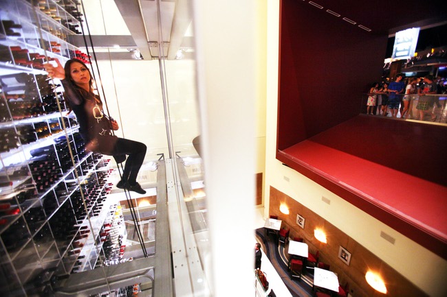 'Wine angels' scale a four-story glass tower for the perfect Chardonnay ...