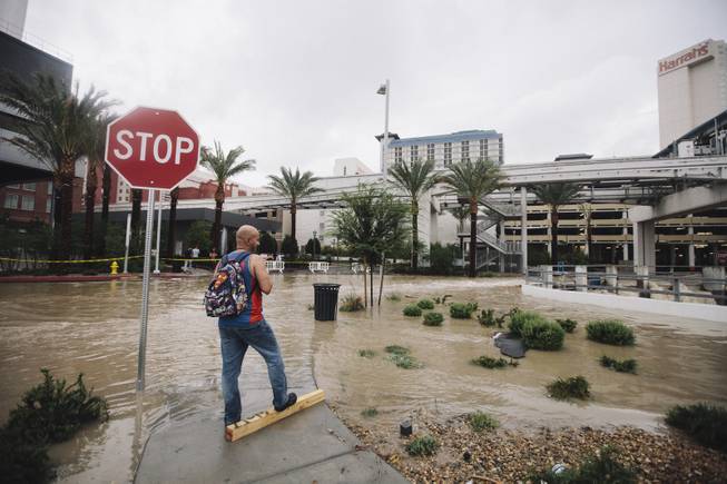 Flooding at The Linq - A flash flood rages through the LINQ parking ...