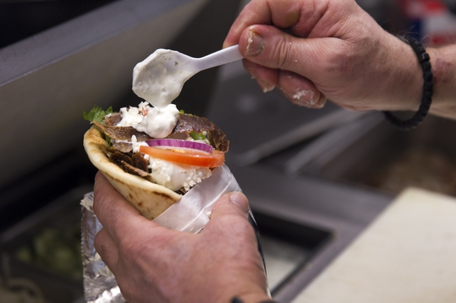 Yassou Greek Cafe - Owner Peter Papas creates a Big Fat Gyro at Yassou