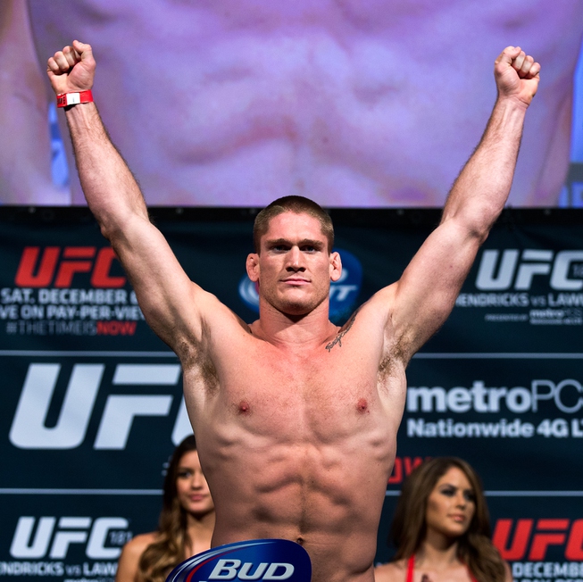 UFC 181 Weigh-In at Mandalay Bay - Heavyweight Todd Duffee raises his ...
