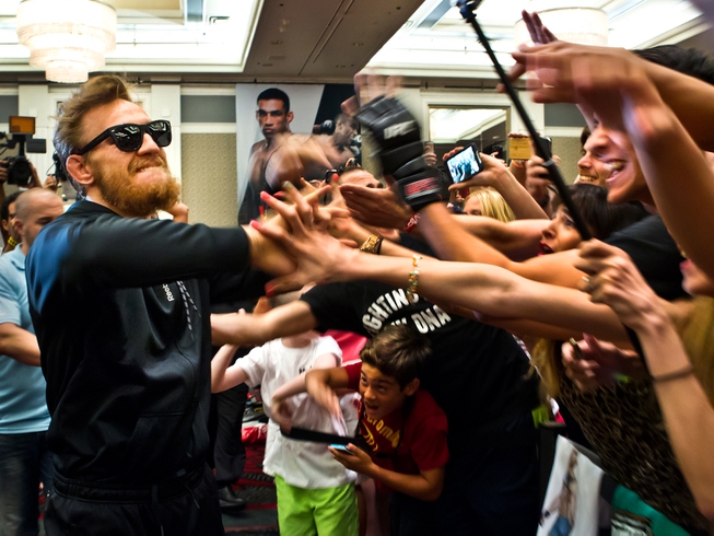 UFC 189 Workout Sessions - UFC 189 fighter Conor McGregor greets his ...