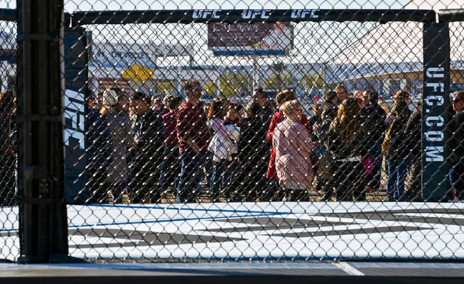 Groundbreaking of UFC Headquarters - Attendees chat beside an octagon ...