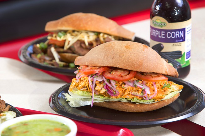 Pollo Inka Express - Inka Sandwich, foreground, and Pan Con Lomo at ...
