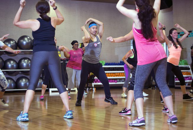 Healthy Habits: Dr. Teddy Sim - Chiropractor Teddy Sim, center, teaches ...