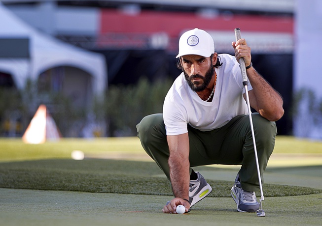 One Putt For One Drop - Actor Eric Carrigan lines up a putt during the ...