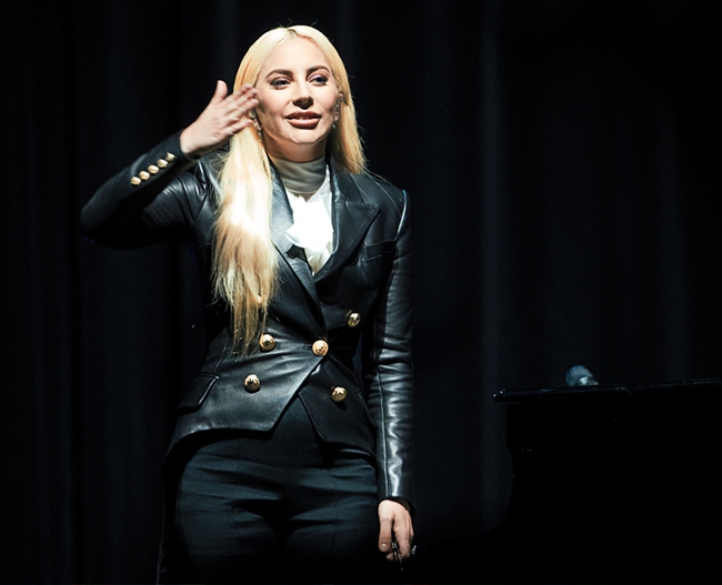 Lady Gaga falls off stage in fan's arms at Las Vegas Enigma show - Las ...