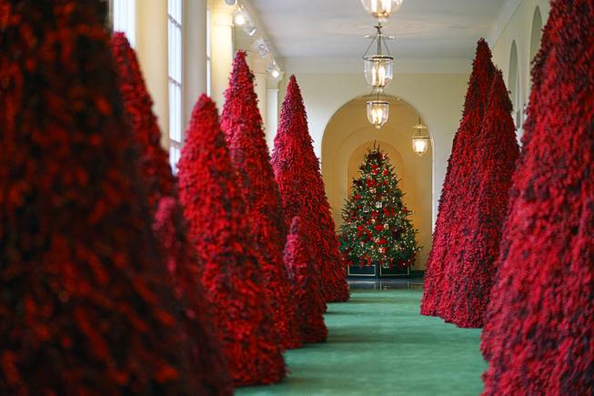 Melania Trump's red topiary trees a hit at Christmas parties - Las ...