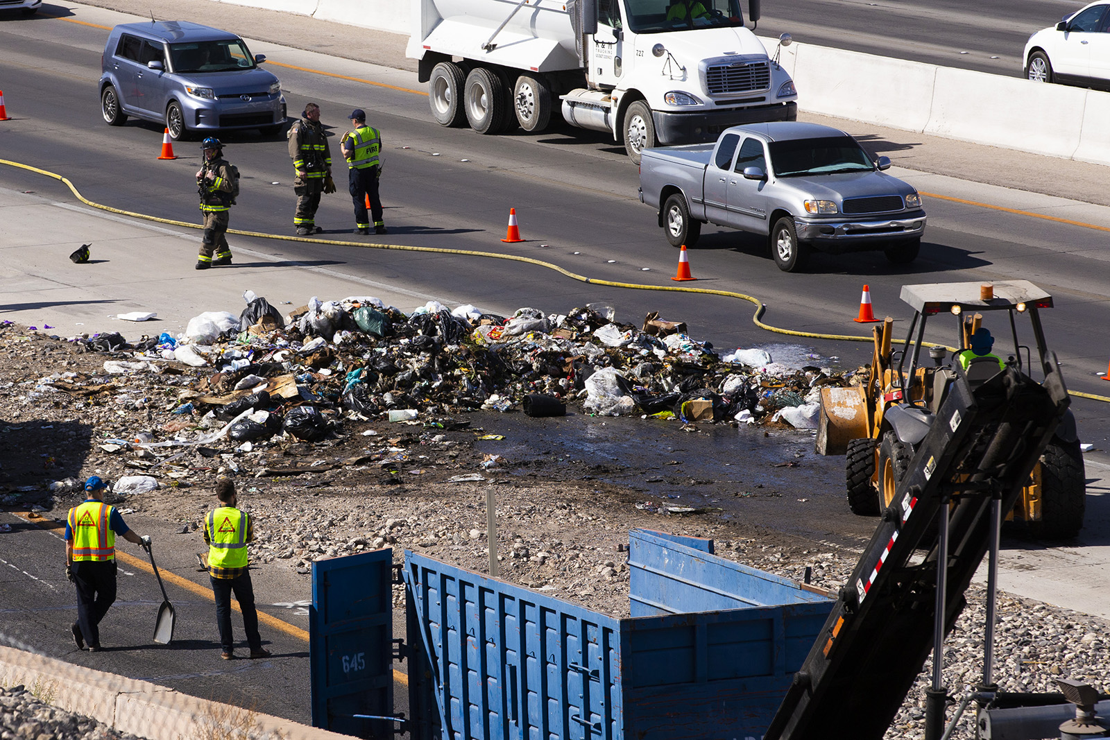 Garbage Spill Cleanup on 215 Eastbound - Las Vegas Sun News