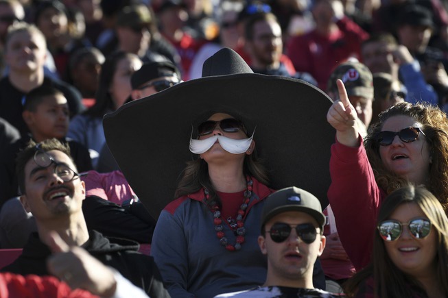 UNLV vs San Jose - A UNLV fan wears a novelty hat and mustache to ... -
