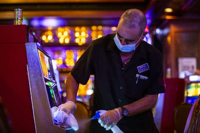 El Cortez Coin Machines - Casino porter Jesus Reyes sanitizes a video ...