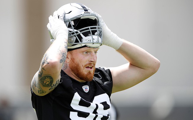 Raiders Off-Season Practice 3 - Las Vegas Raiders defensive end Maxx Crosby (98) puts on ... -
