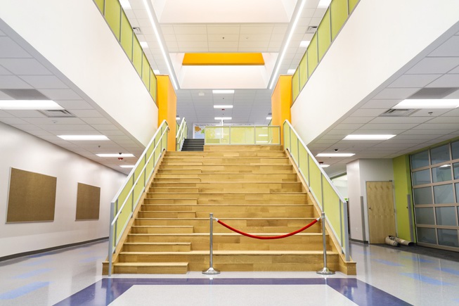 Newly Rebuilt George E. Harris Elementary - Stairs with seating next to ...