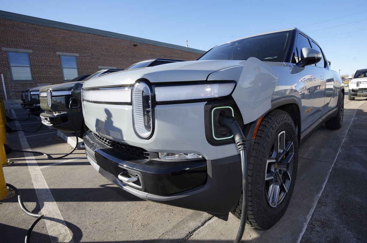 Tesla consolidates power as Rivian joins charging network - Las Vegas ...
